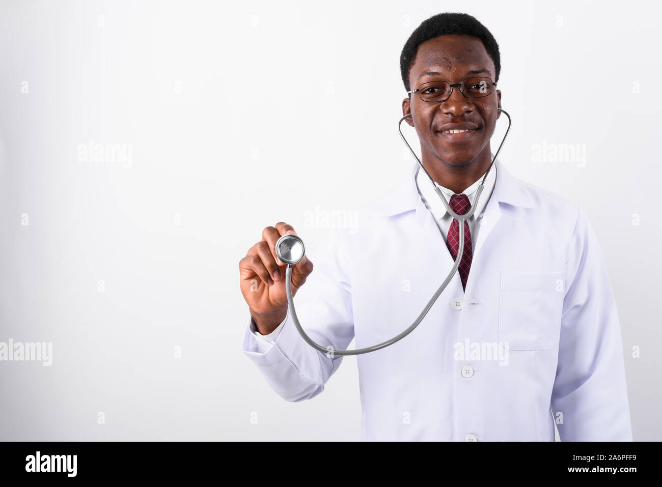 Young handsome African man doctor using stethoscope against whit Stock ...