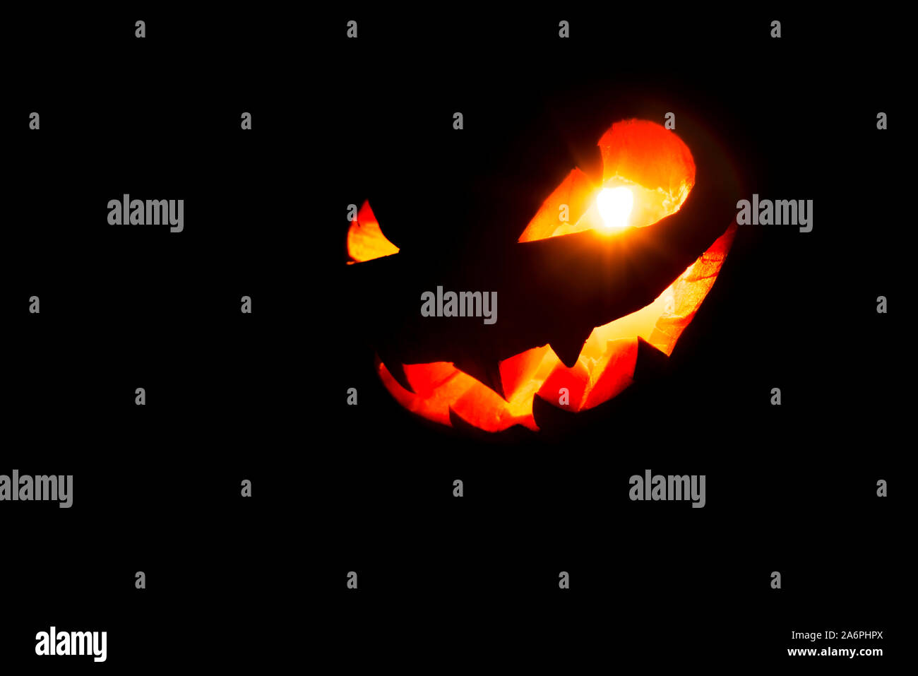 Halloween pumpkin smile and scary eyes for party night. Close up view ...