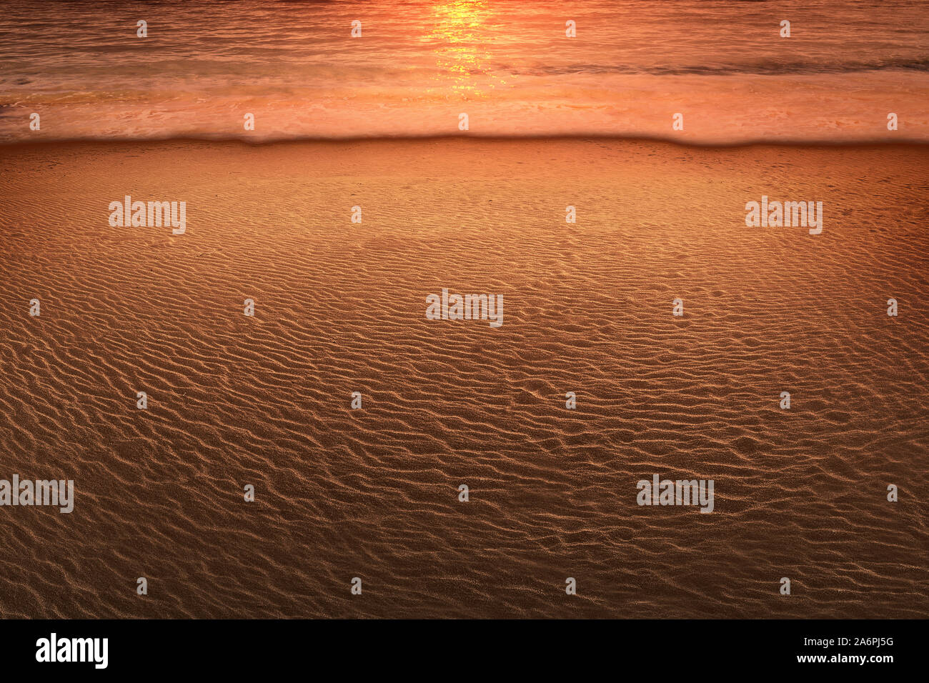Sandy beach with the blue ocean and sunset sky background Stock Photo ...