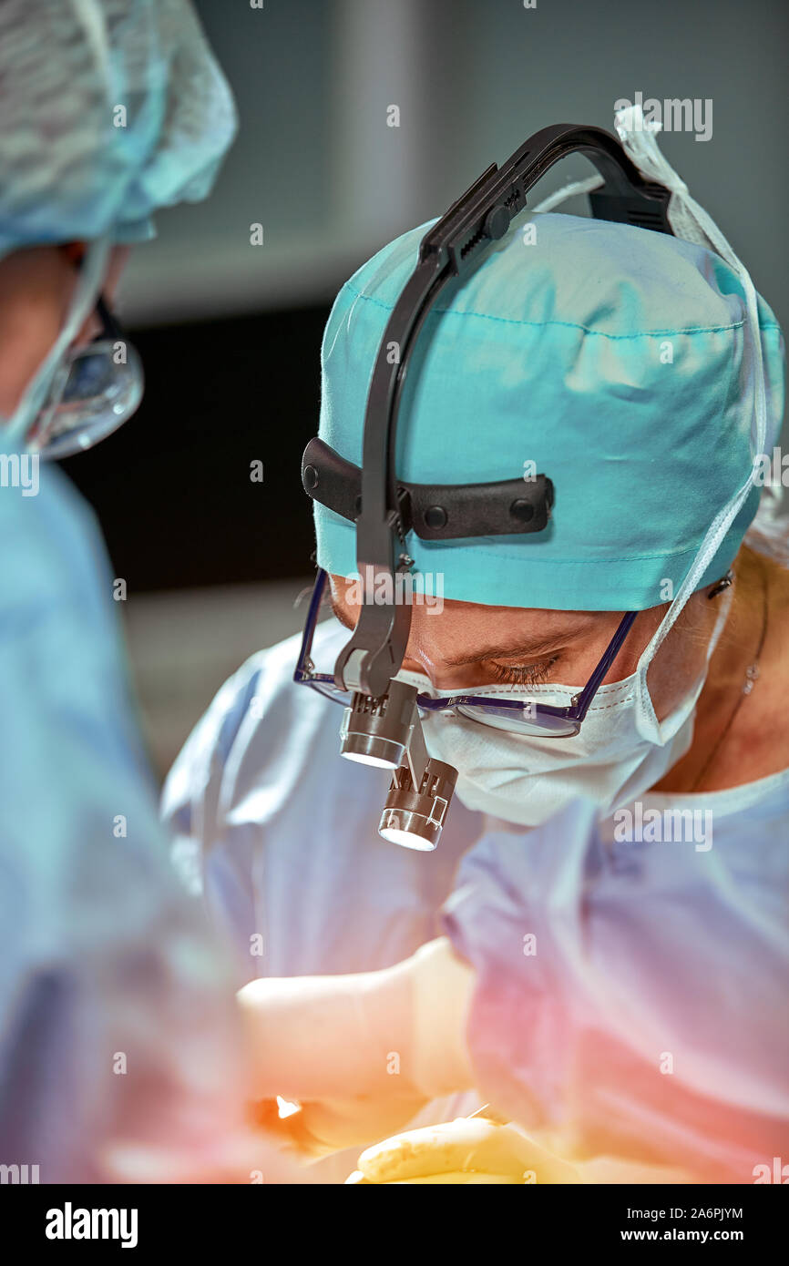 Portrait of a team of surgeons at work. During surgery. Concept ...