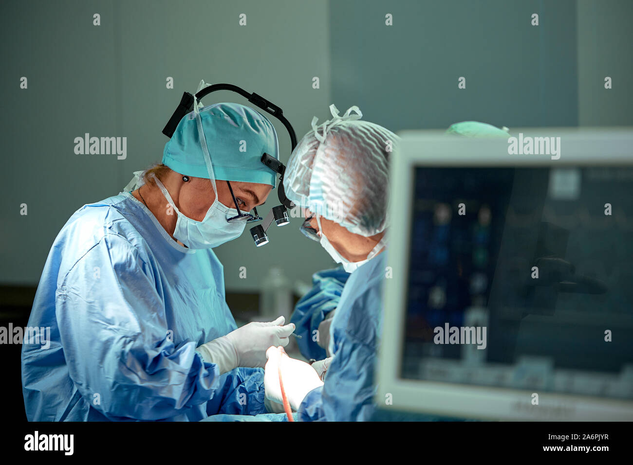 Portrait of a team of surgeons at work. During surgery. Concept ...