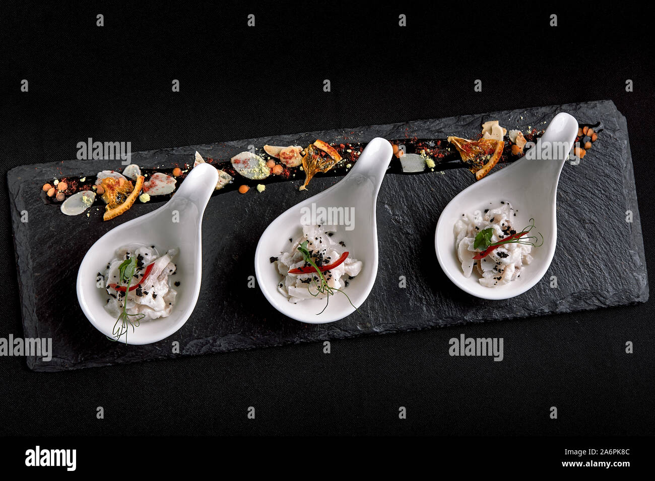 Sea bass ceviche mini portions served in beautiful Chinese spoons on a ...