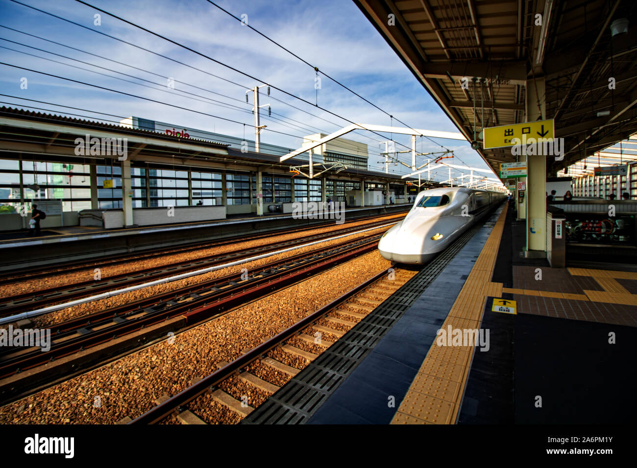 A Japan Railways Shinkansen high speed bullet train speeds into Kyoto ...