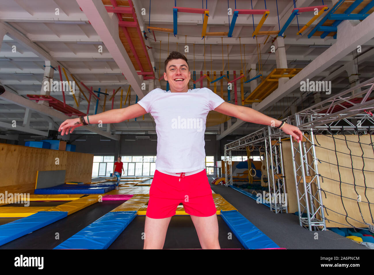 Fitness, fun, leisure and sport activity concept - Handsome happy man ...