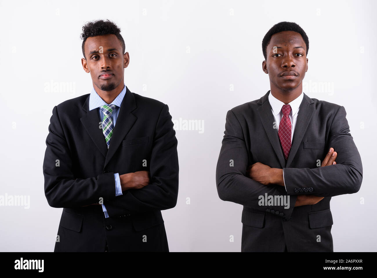 Two young African businessmen against white background Stock Photo - Alamy