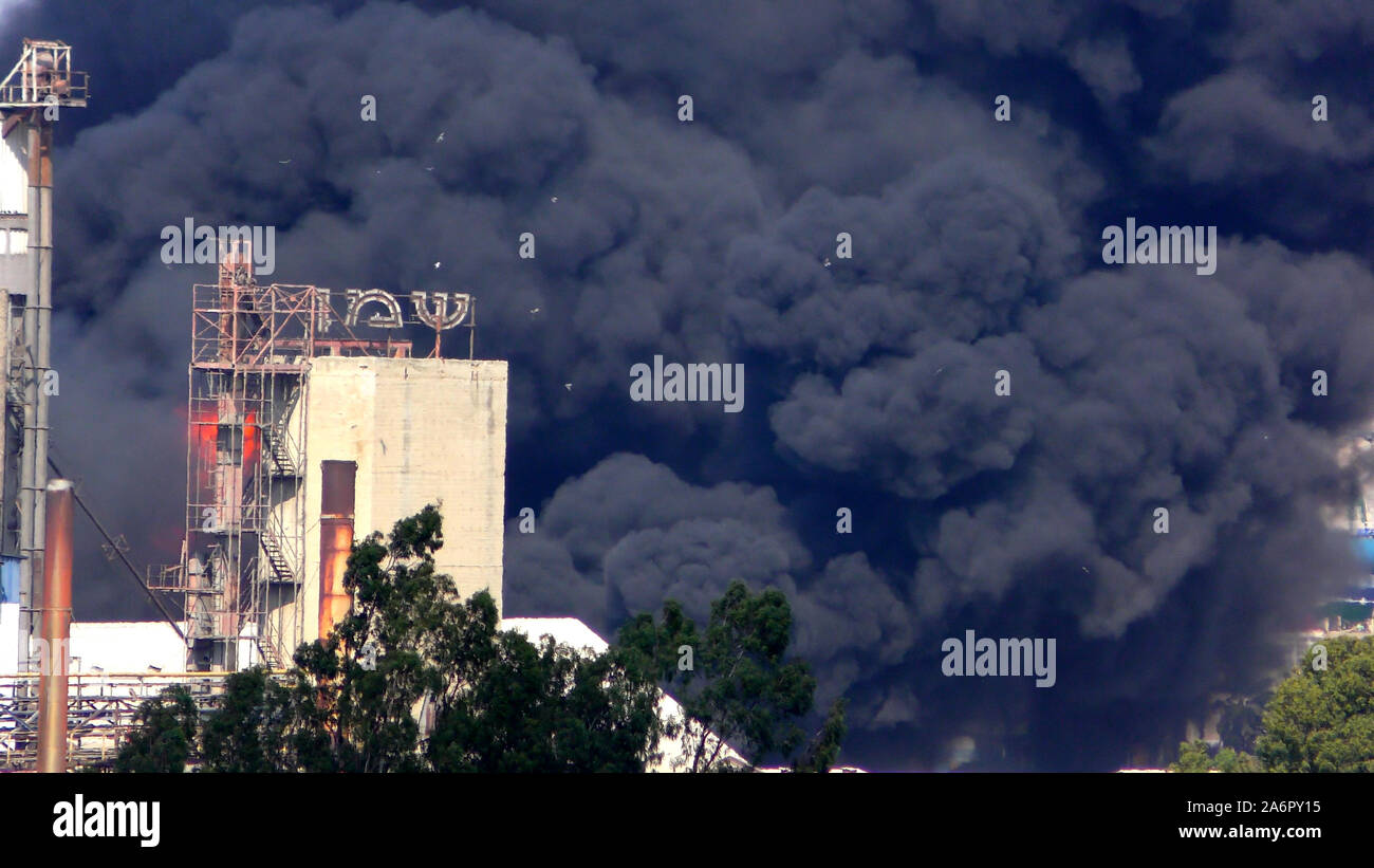 Flames of 80 tonnes of cooking oil burning in Shemen factory. Smog ...