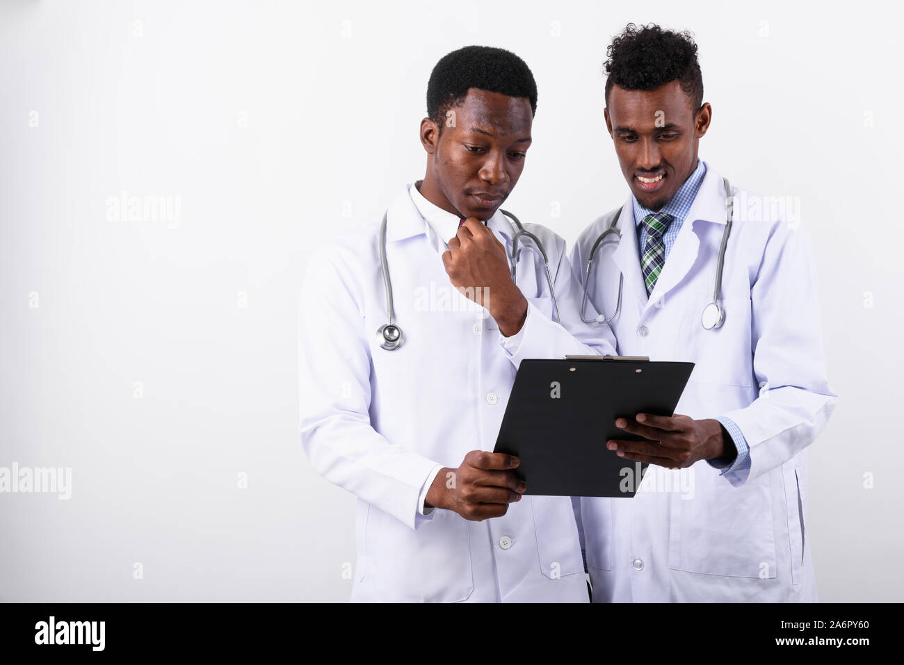 Two young African man doctors against white background Stock Photo - Alamy