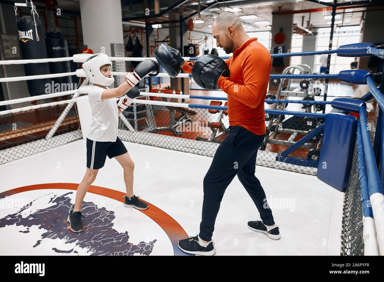 Boy boxing training punch mitts hi-res stock photography and images - Alamy