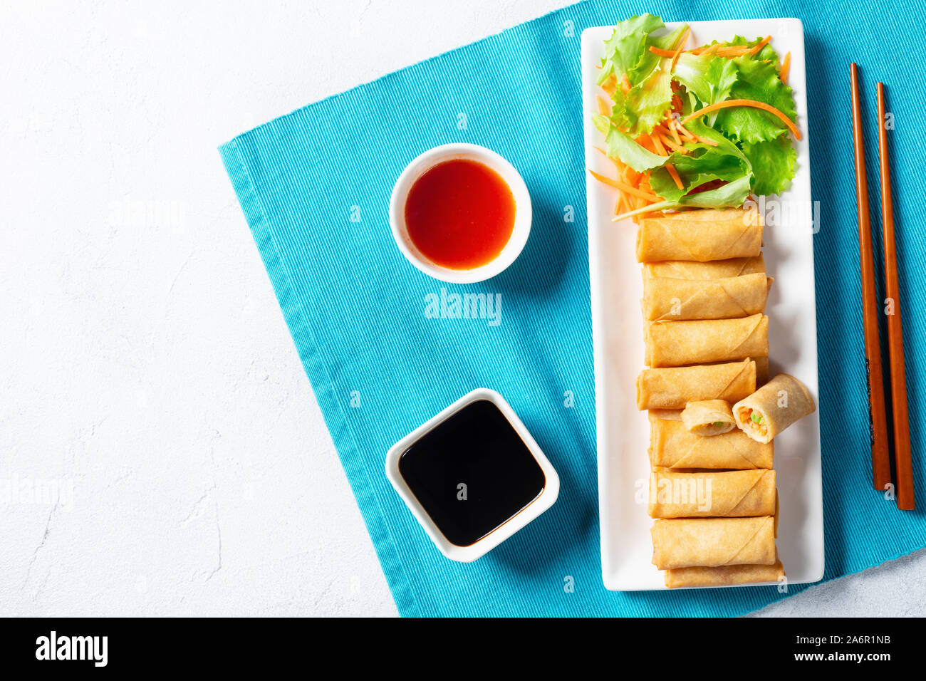 crispy bite-sized Chinese spring rolls with cabbage, carrots and green ...