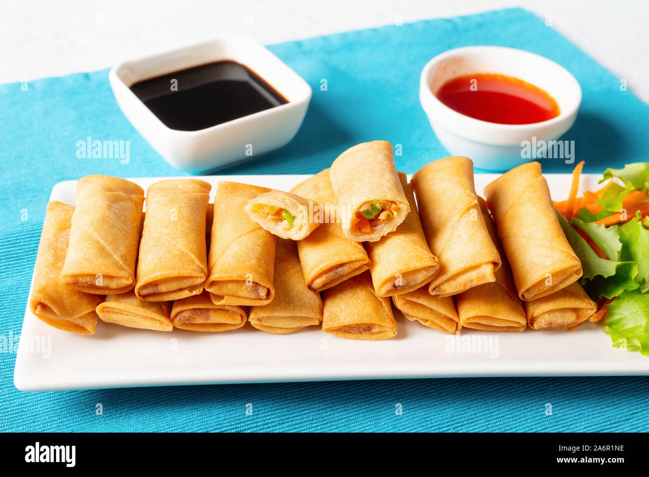 crispy bite-sized Chinese spring rolls with cabbage, carrots and green ...