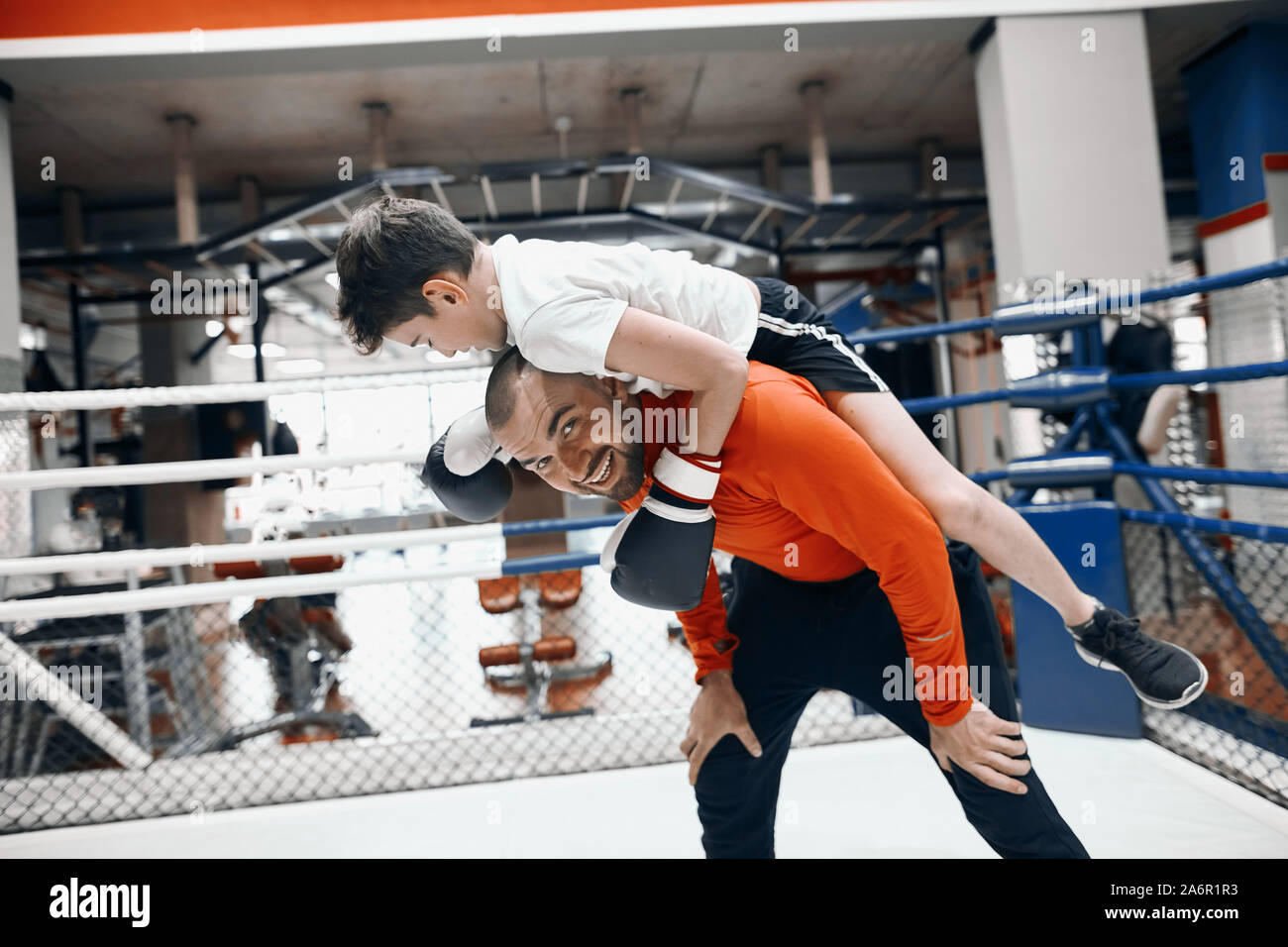 little strong boy attacking his father, lying on his back, close up ...