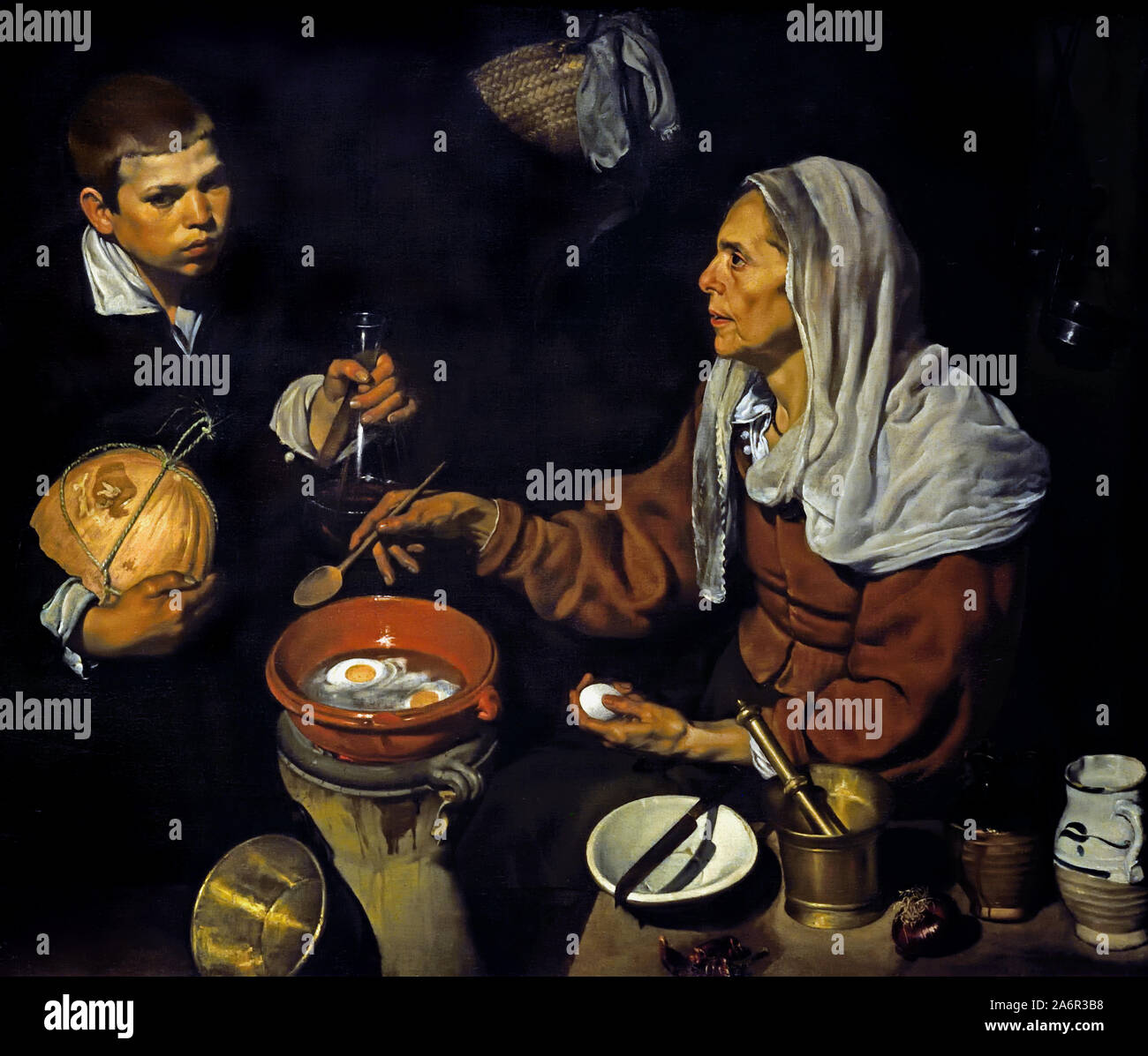 Old woman frying eggs hi-res stock photography and images - Alamy