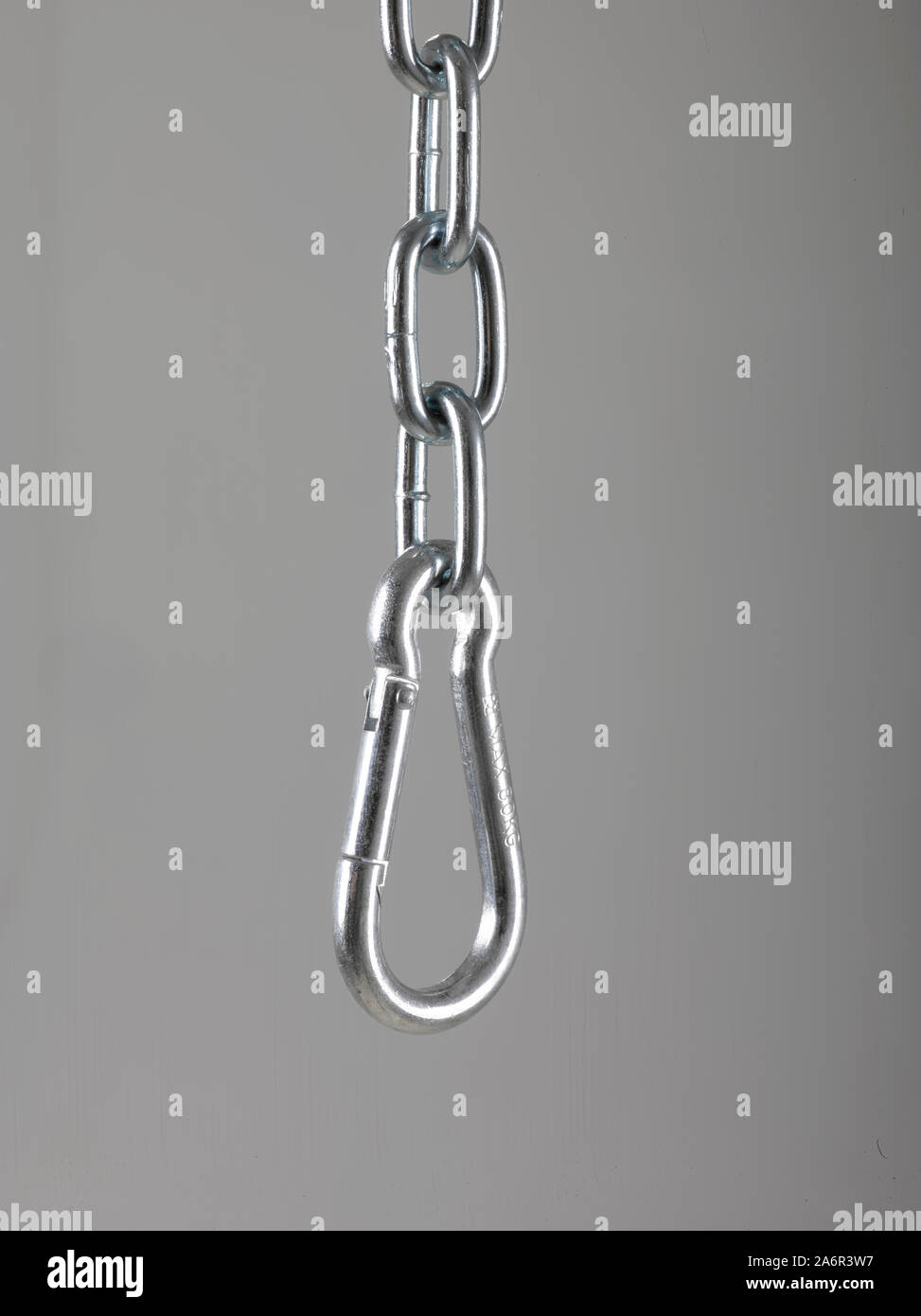Metallic chain over a white background Stock Photo - Alamy