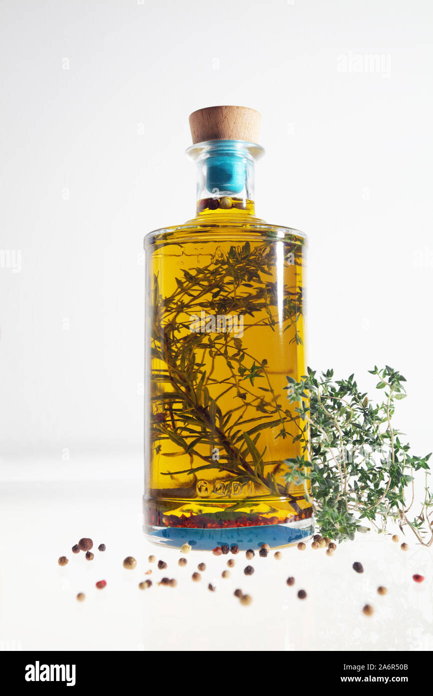 DIY herbal oil in an old Malfy Gin bottle Stock Photo - Alamy