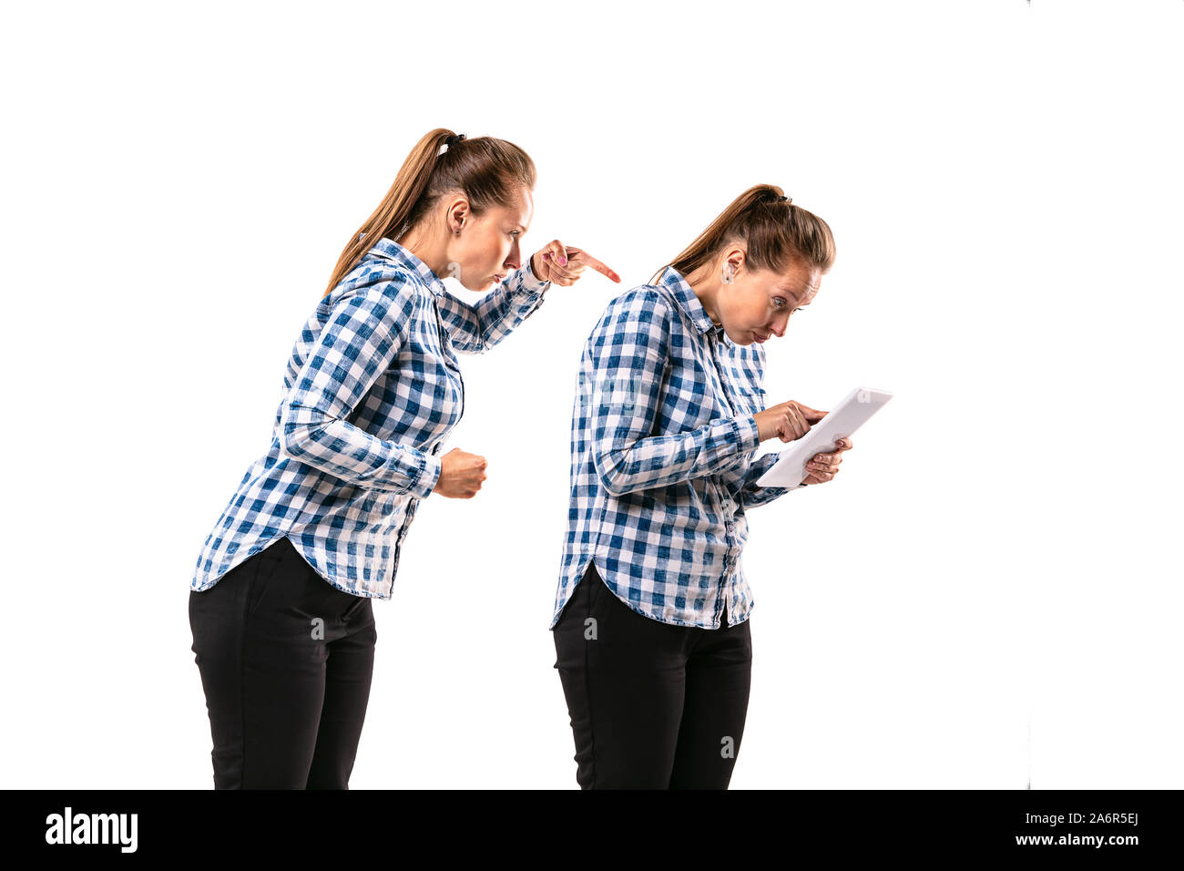 Young handsome woman arguing with herself on white studio background ...