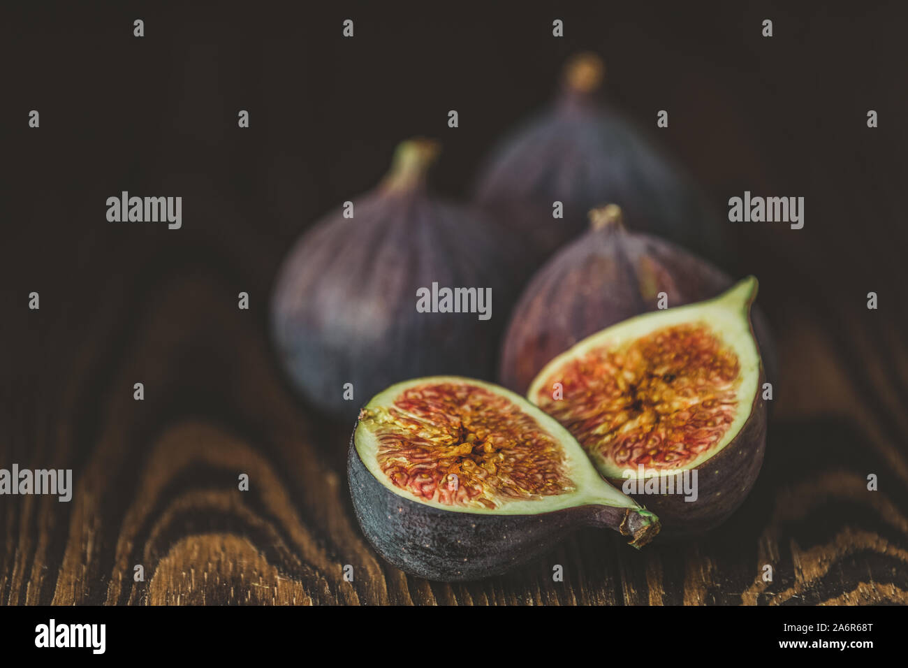 Ripe Fig Fruits on old wooden background. Paleo diet, still life with ...