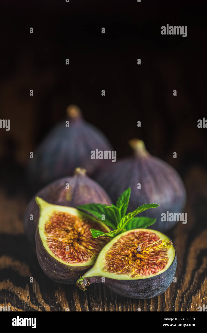 Ripe Fig Fruits on old wooden background. Paleo diet, still life with ...
