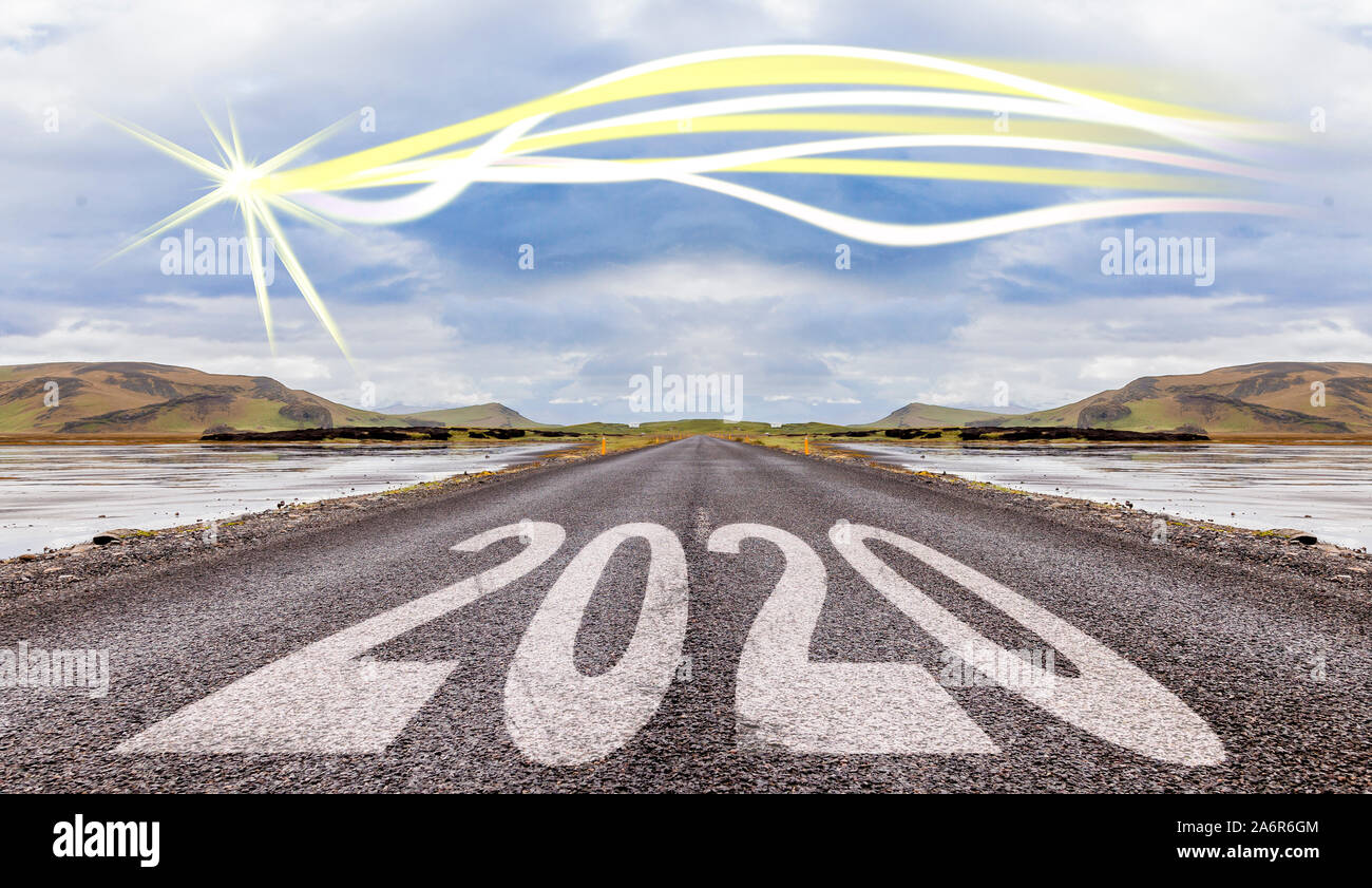 2020 New Year celebration on the asphalt road with a modern comet star ...