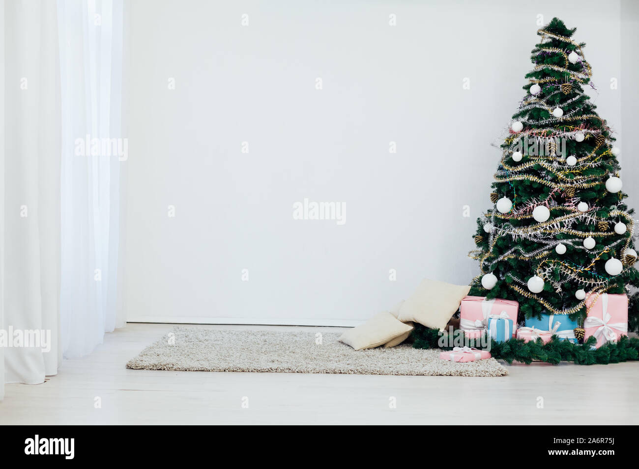 Christmas tree with gifts for the new year in the interior Stock Photo ...