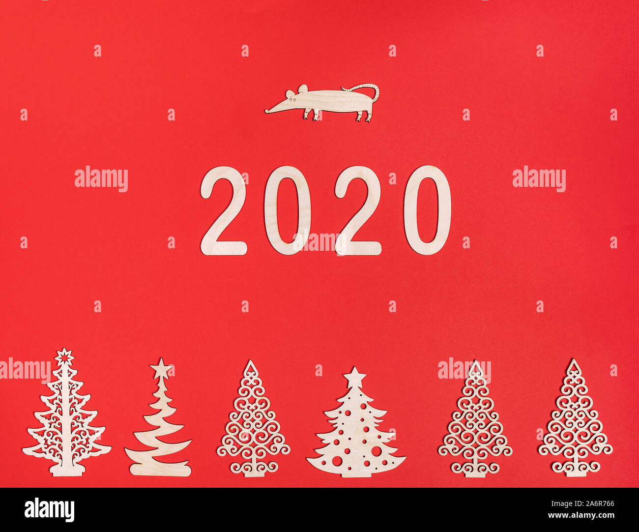 Creative minimal Xmas mockup on red background with wooden decorations ...