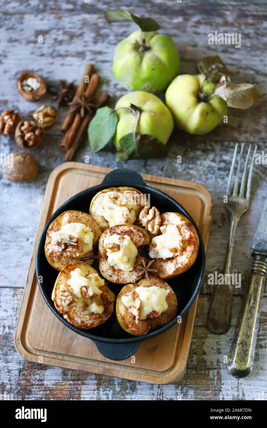 Baked quince with cinnamon and cream cheese. Healthy autumn food. Keto ...