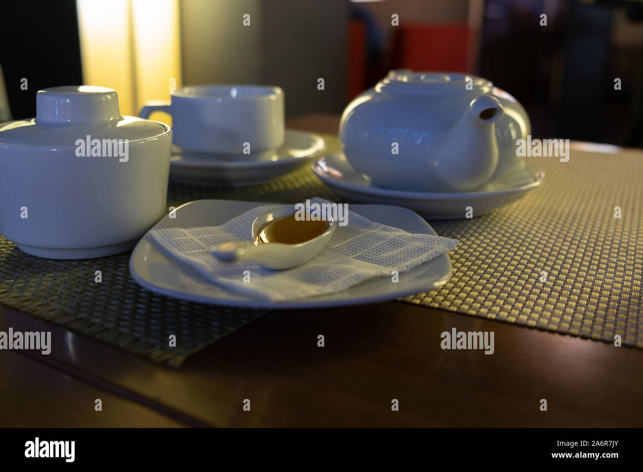 Tea set with honey in restaurant. evening calm, relax Stock Photo - Alamy