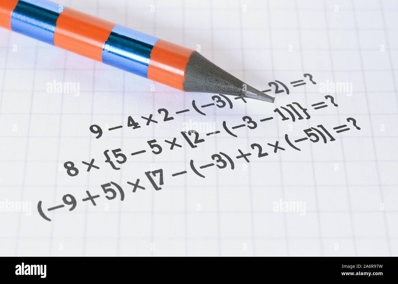 Example of the basic math operations and a pencil on bright background ...