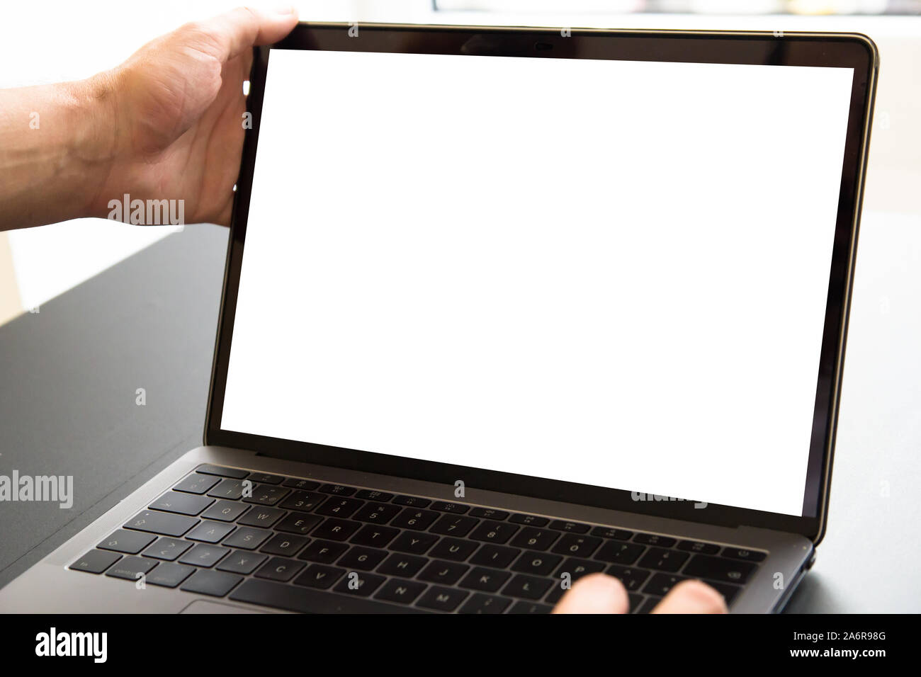 user opening laptop with white screen mockup Stock Photo - Alamy