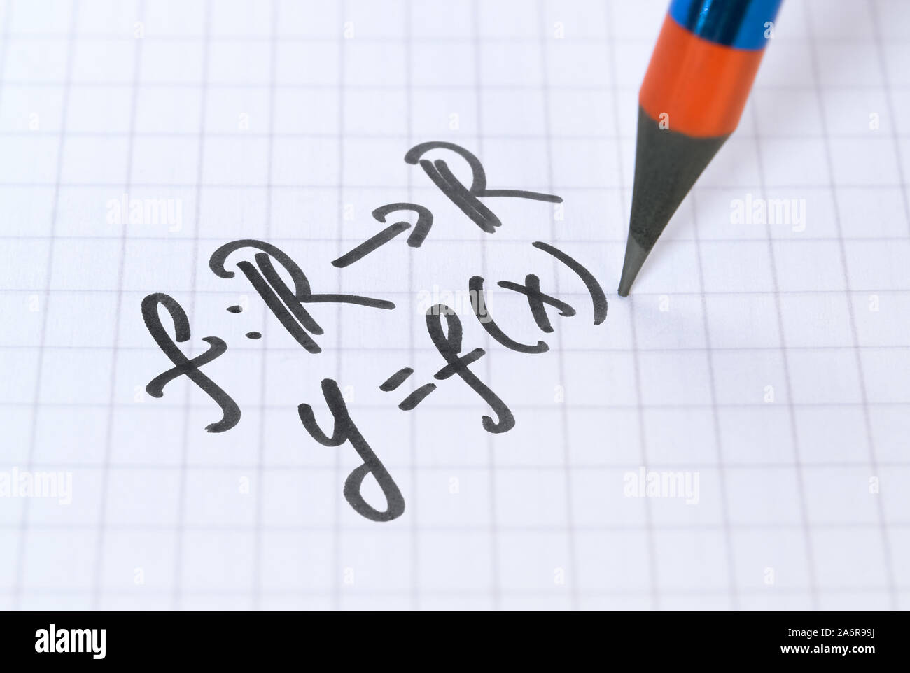 Definition of a real valued function and a pencil on bright background ...