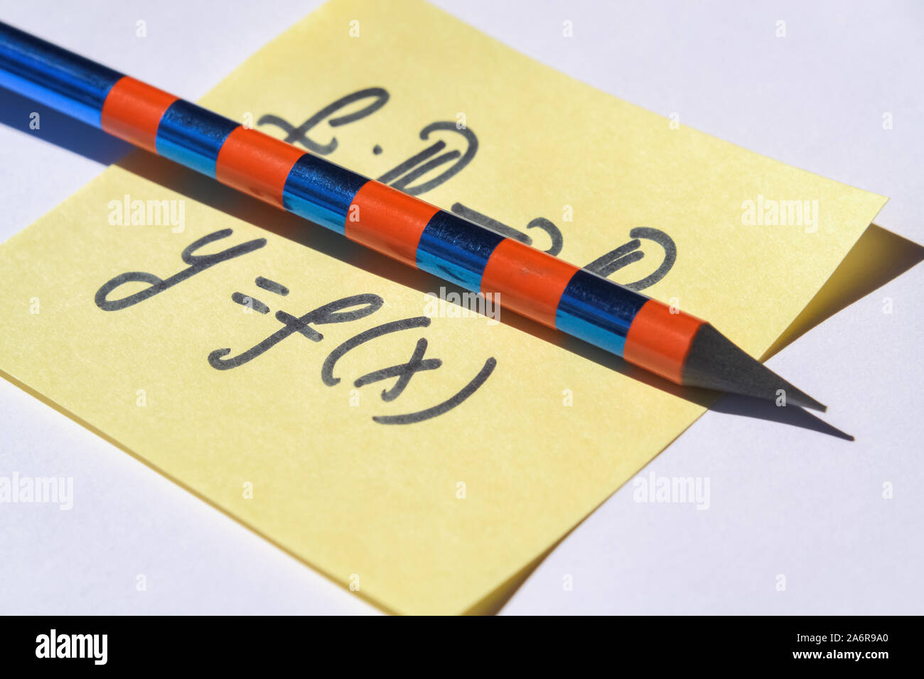 Definition of a real valued function and a pencil on bright background ...