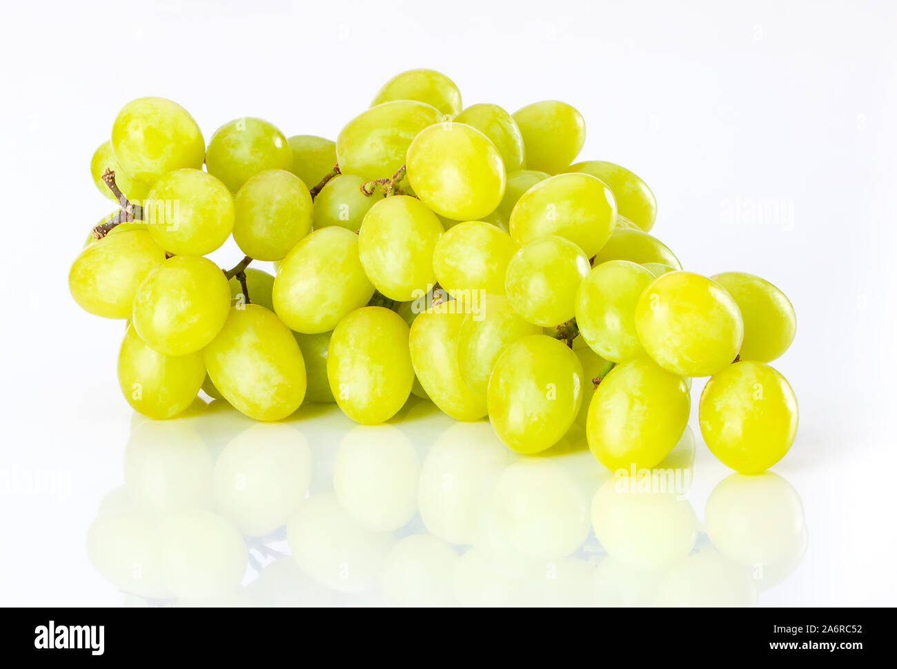 Fresh green grapes on white reflecting background Stock Photo - Alamy