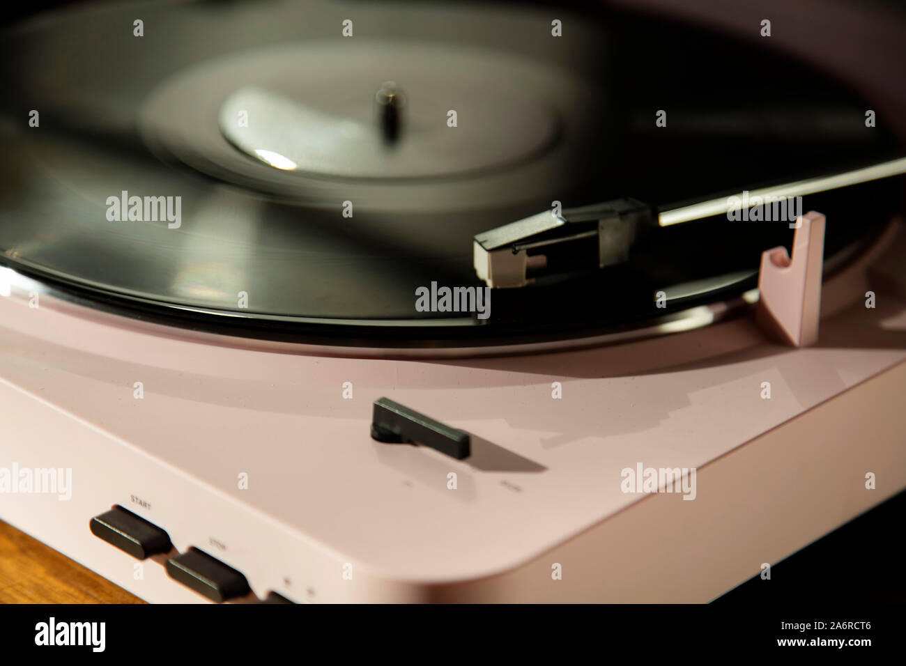 Vintage music record player with a vinyl record Stock Photo - Alamy