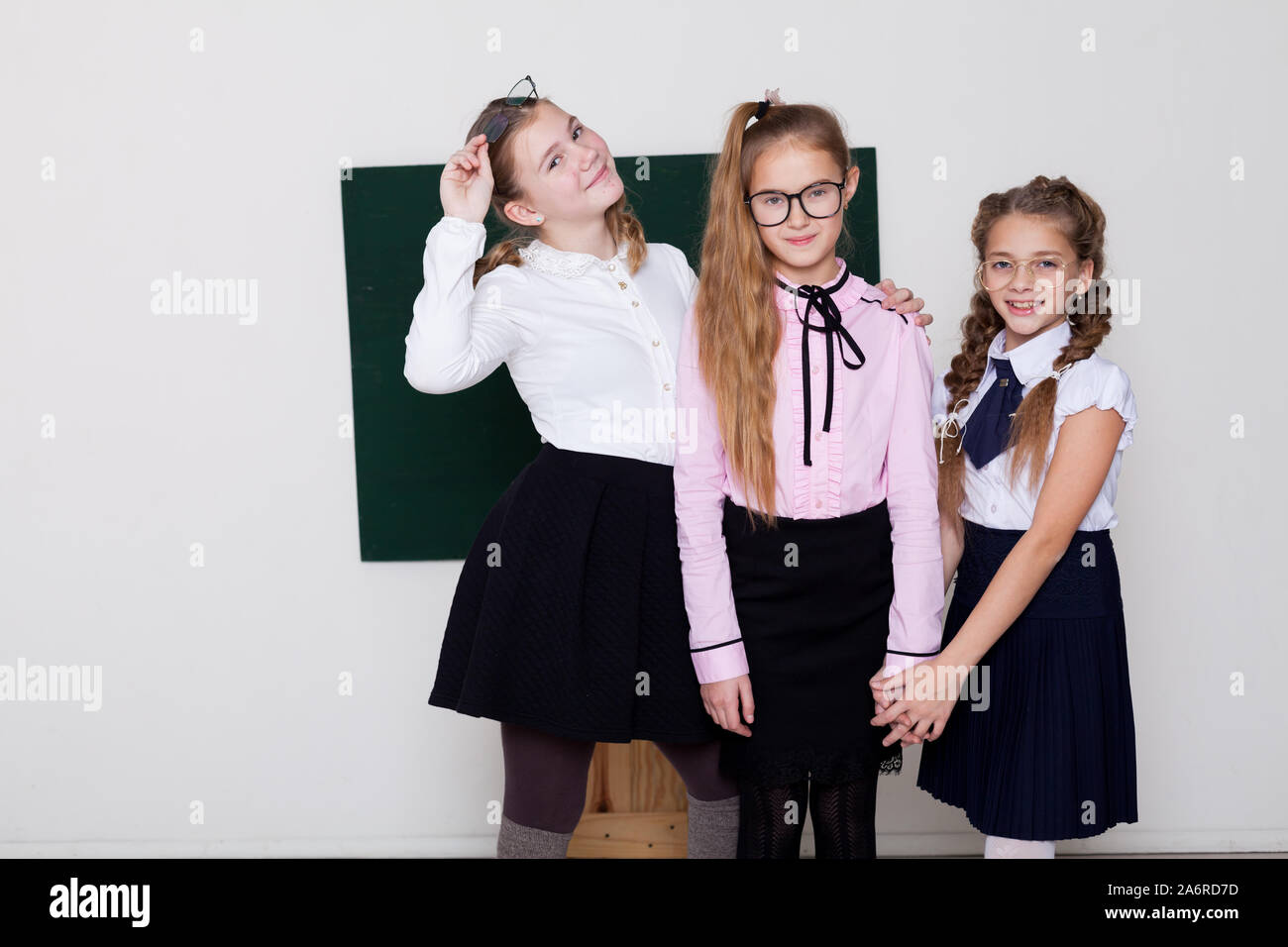 three beautiful girls at the school board in class in class Stock Photo ...