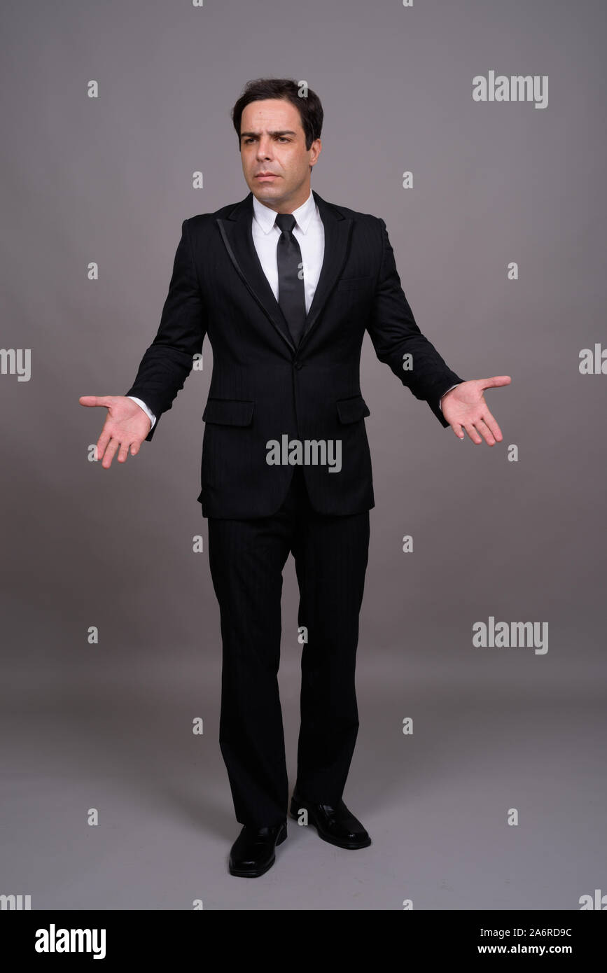 Handsome persian man shrugging shoulders hi-res stock photography and ...