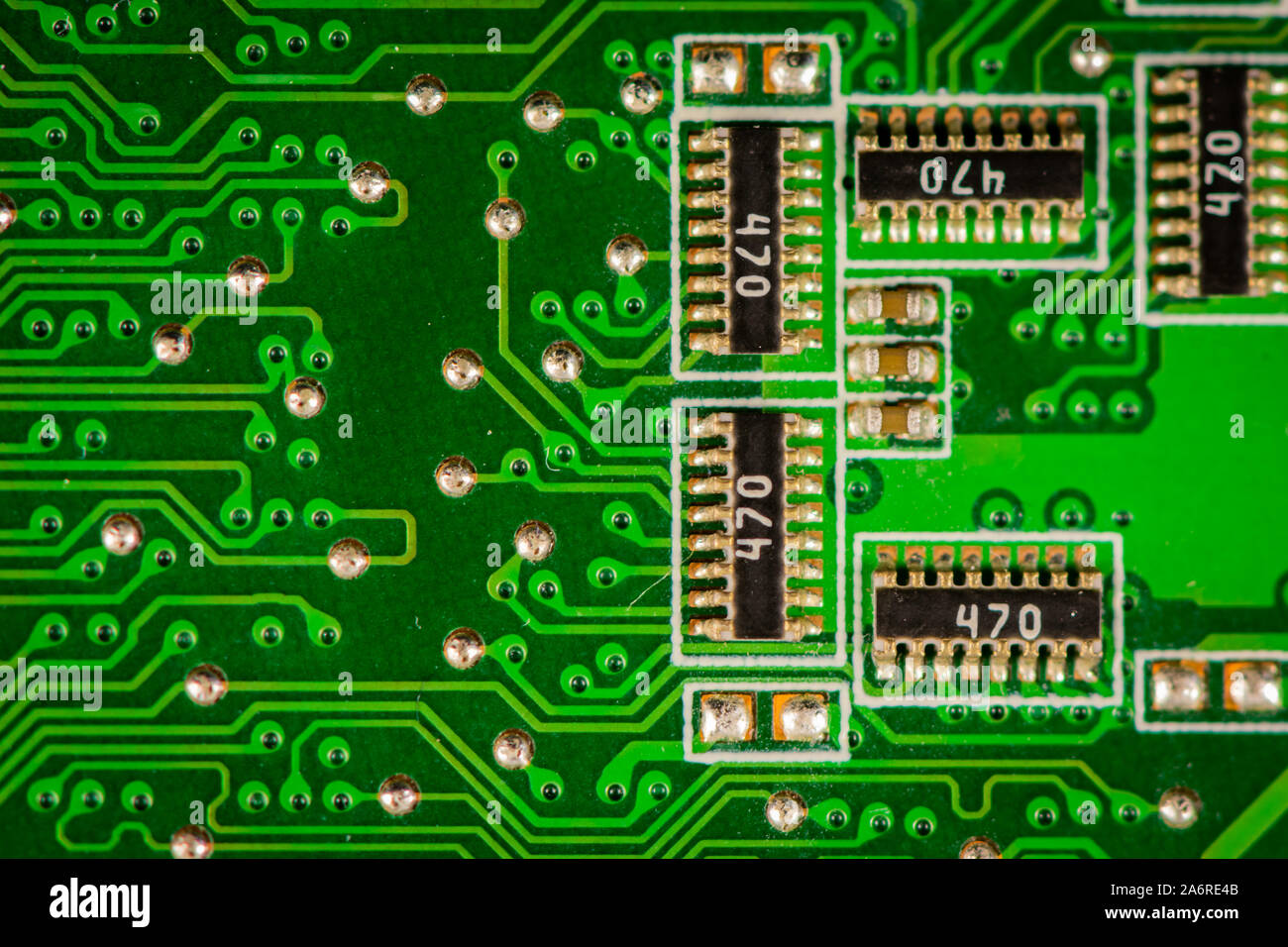 Macro photograph of a green circuit board from old electronic comptuter ...