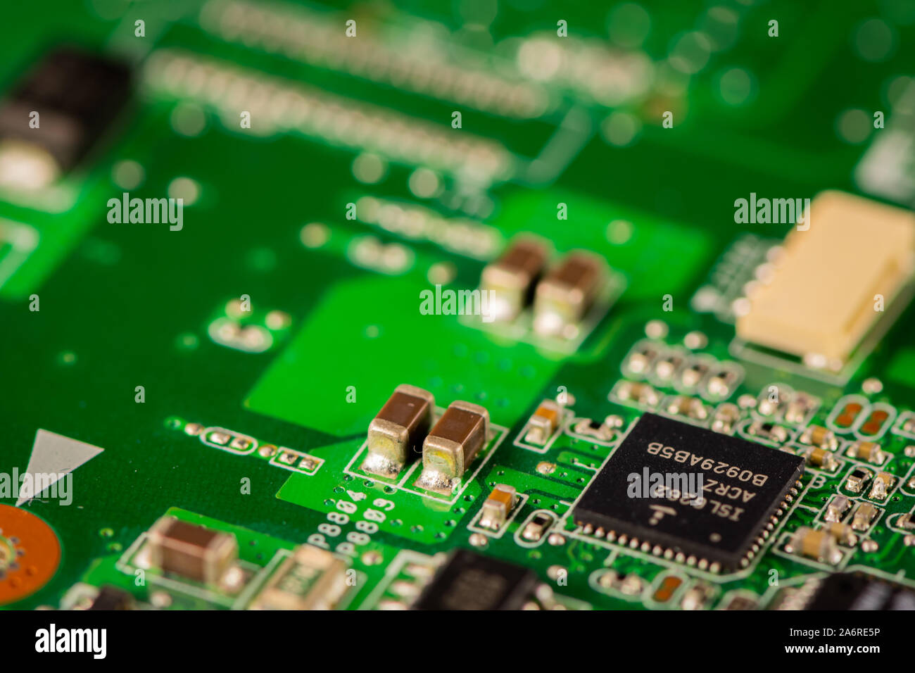 Macro photograph of a green circuit board from old electronic comptuter ...