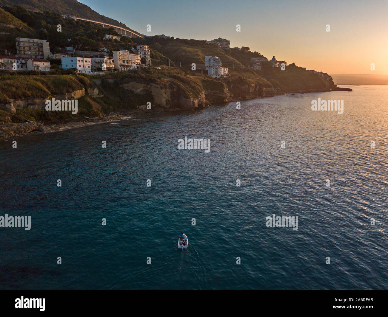 Aerial view of a rowing boat seen from above, powered by an engine ...
