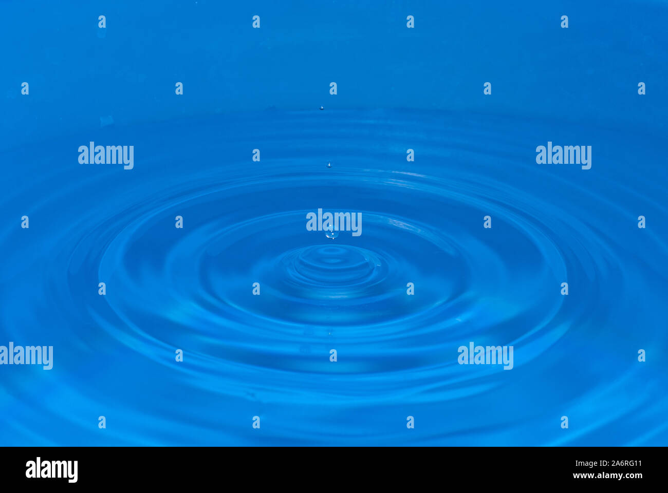 Circular water waves created by a falling drop, from above Stock Photo ...