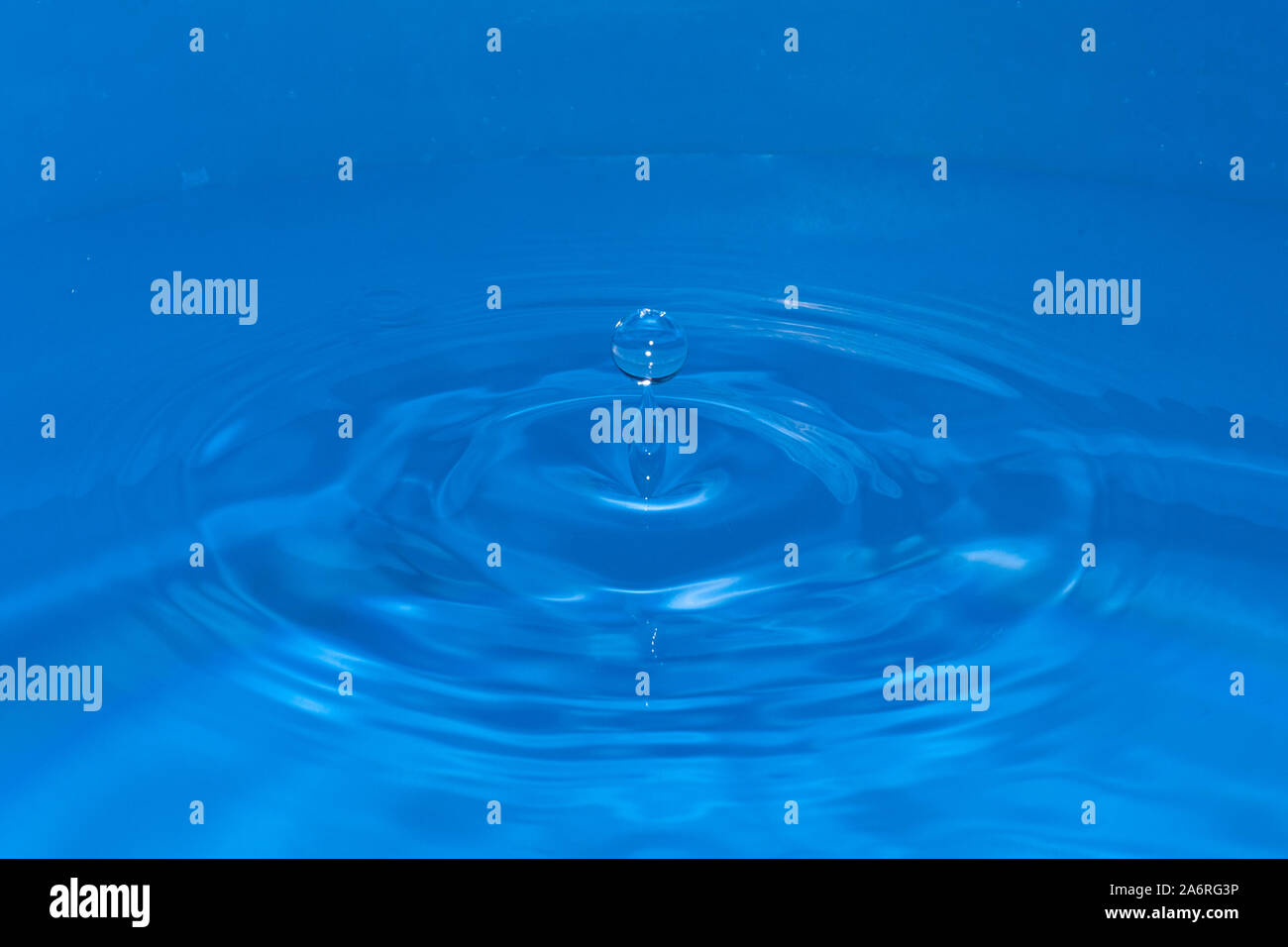 Circular water waves created by a falling drop, with a drop bounce on ...