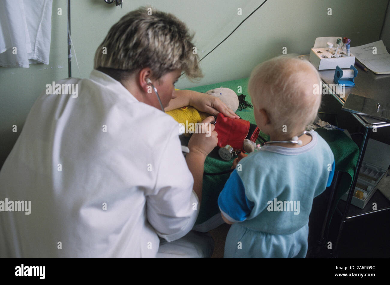 Child playing with doll hi-res stock photography and images - Alamy