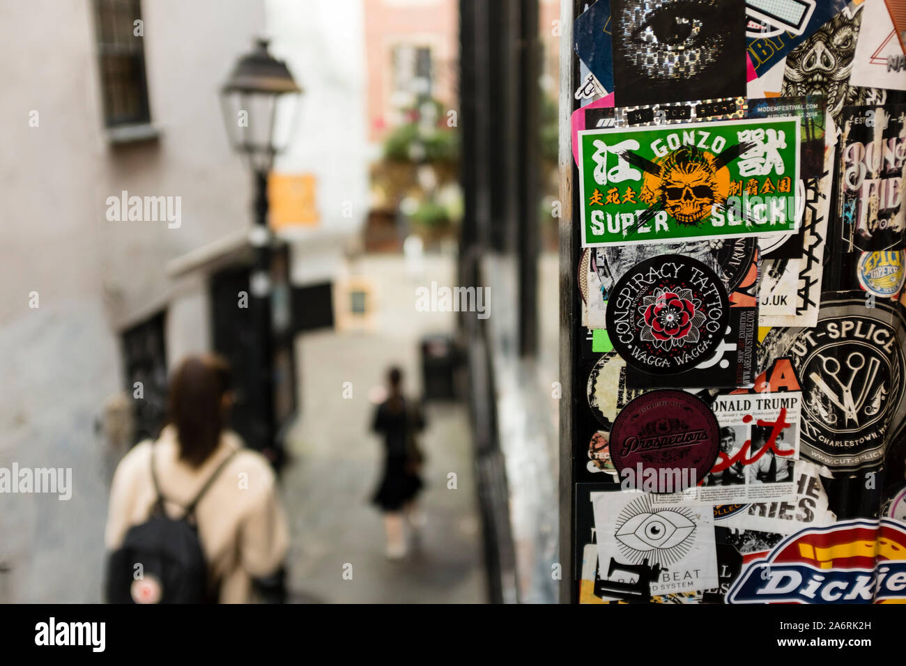 Small business advert stickers on wall, Christmas Steps, Bristol, UK ...