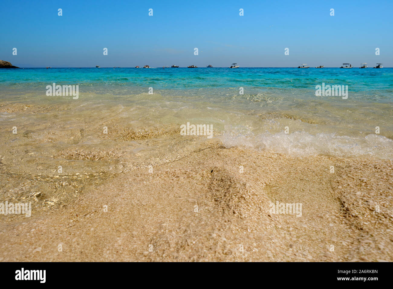 The crystal clear blue sea and white pink sand beach on the Gulf of ...