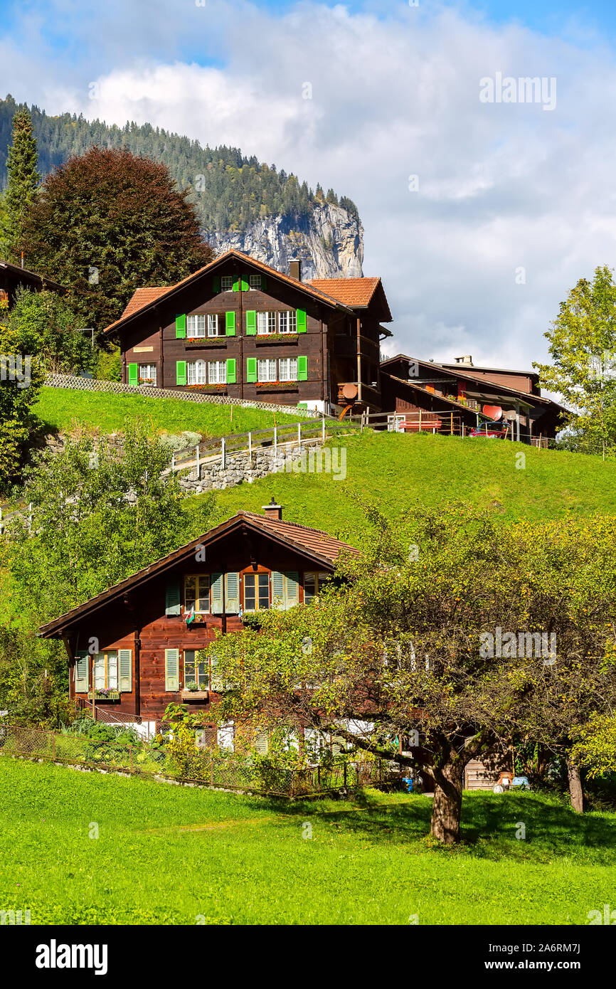 Lauterbrunnen, Switzerland alpine wooden houses in Swiss Alps village ...