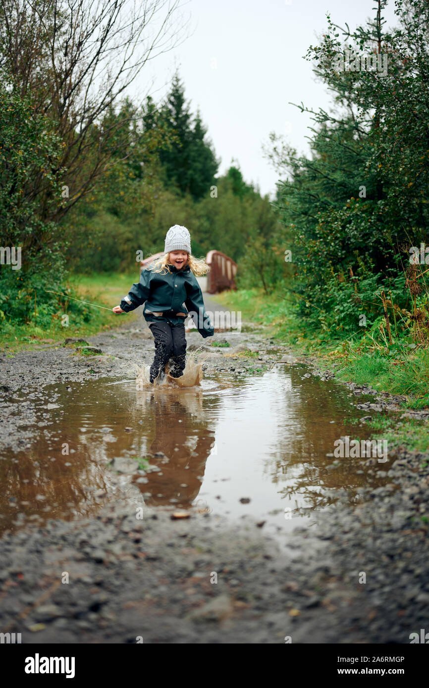Splashing in puddle hi-res stock photography and images - Alamy
