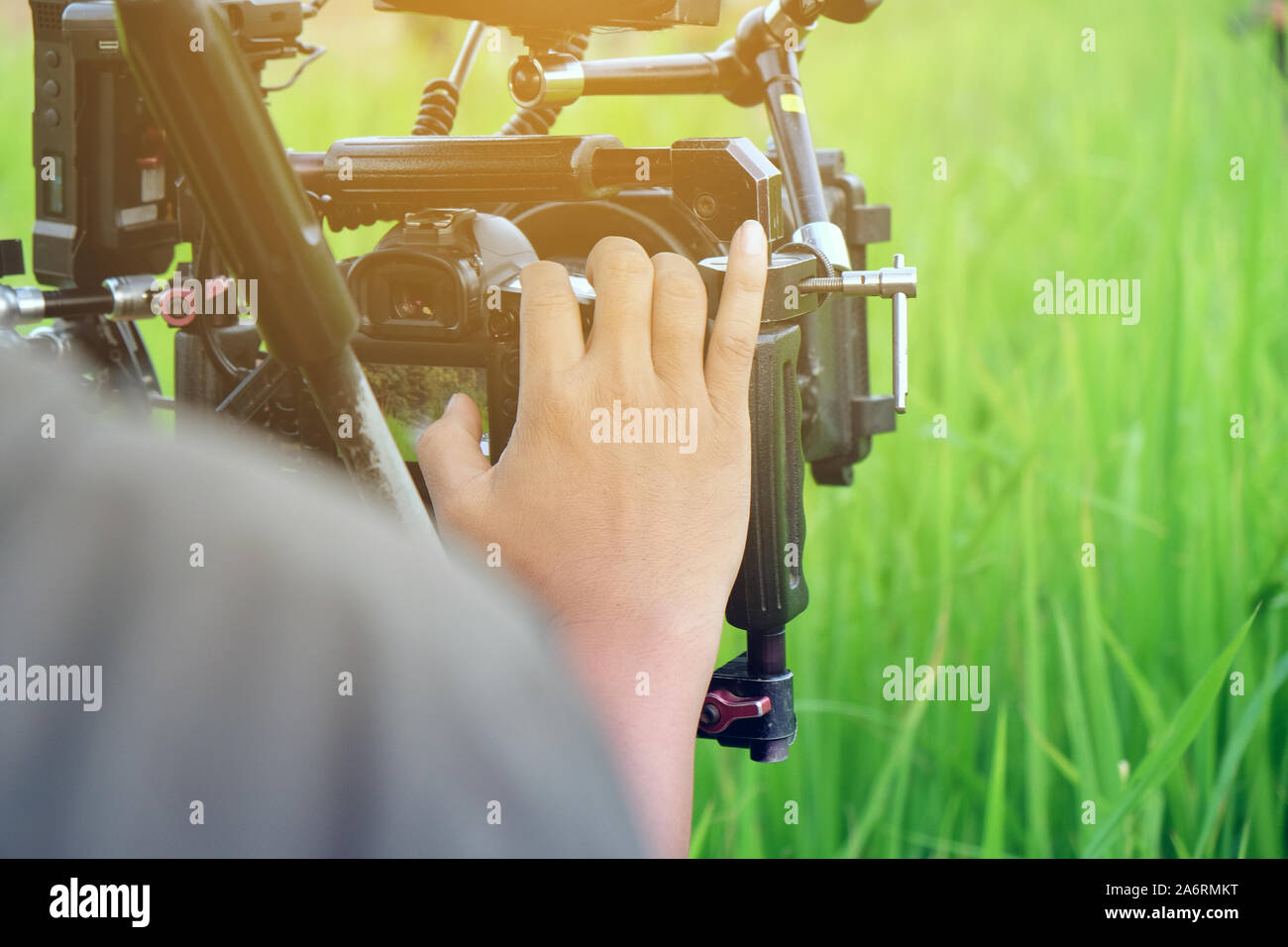 Film industry. cameraman shooting film scene with camera Stock Photo ...