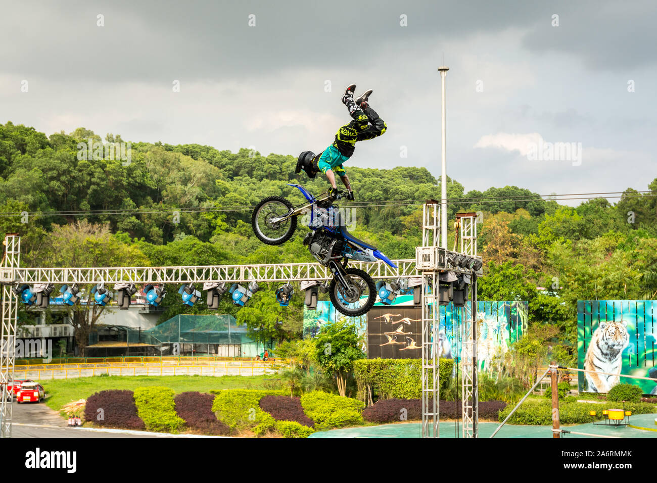 A professional motorcycle rider giving a free style motorcross ...