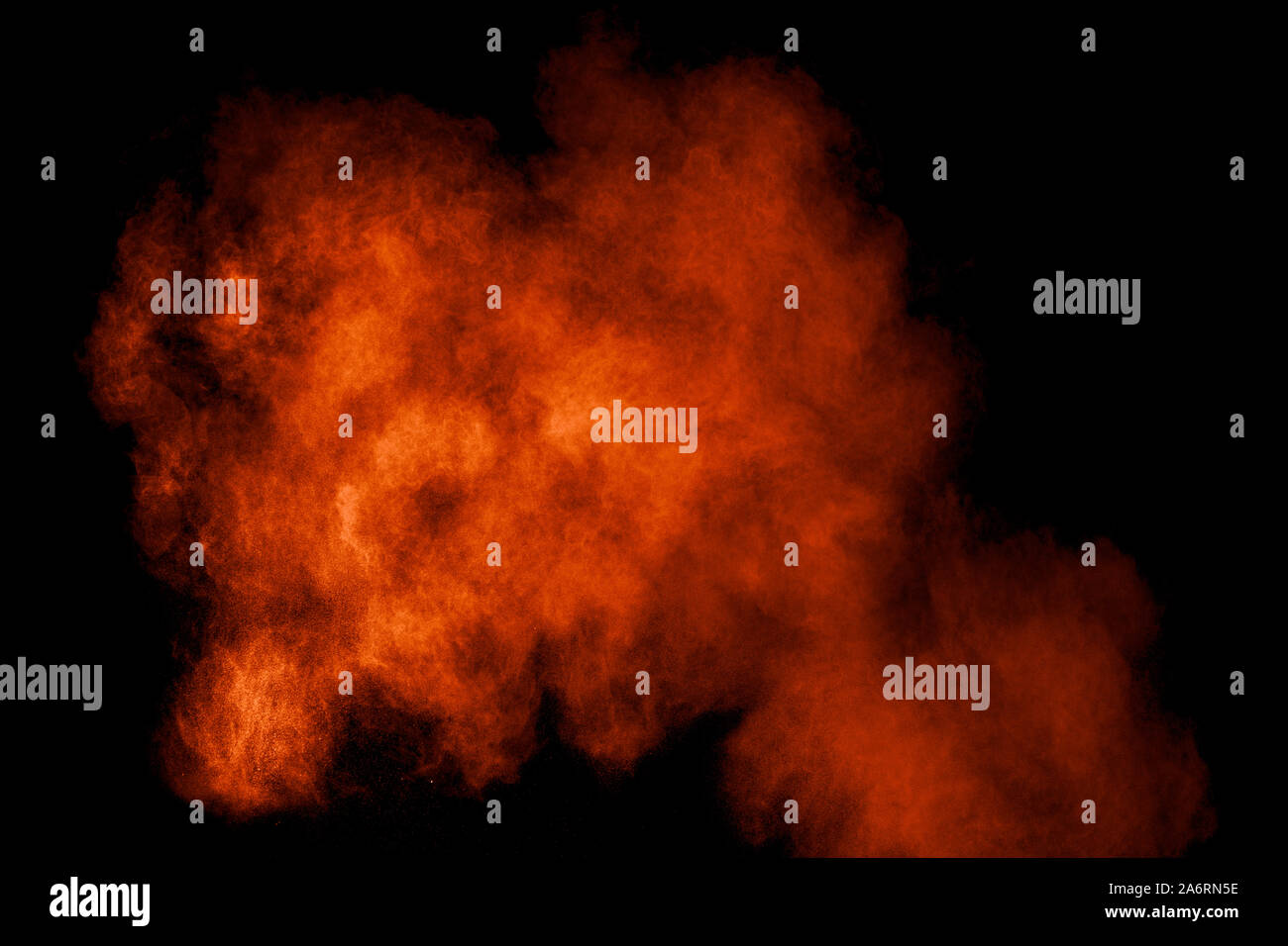 Orange red powder explosion on black background.Orange red color dust ...