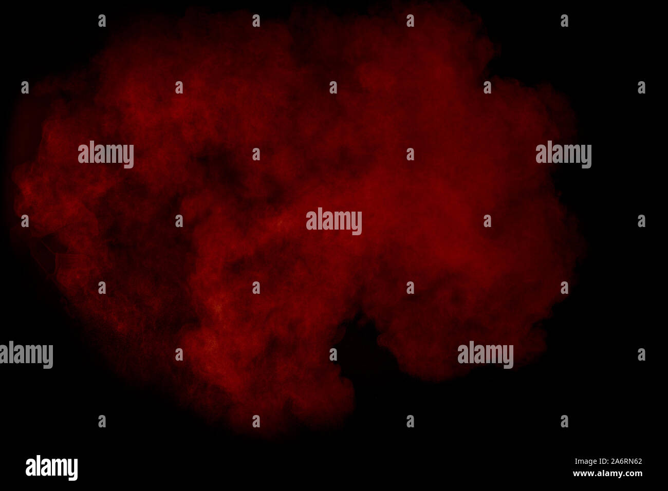 Red powder explosion cloud on black background. Freeze motion of red ...