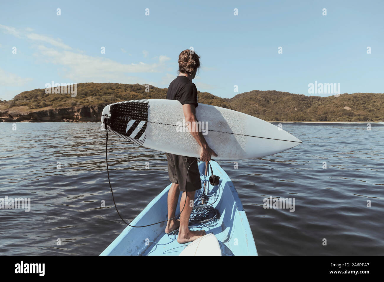Surfer in a boat Stock Photo - Alamy