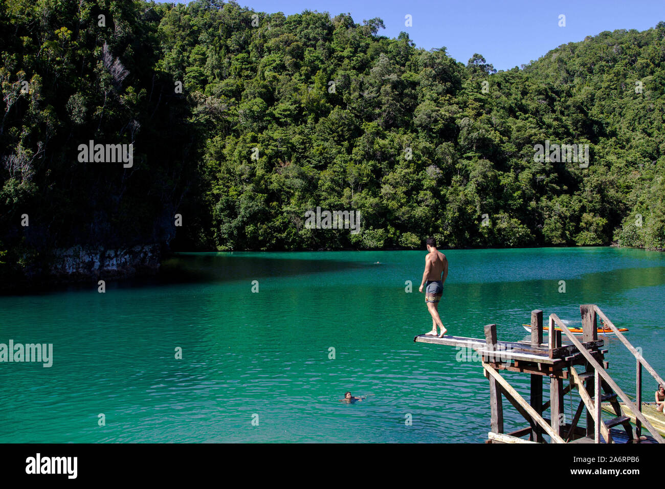 young man tourist jump to sugba lagoon Philippines Stock Photo - Alamy